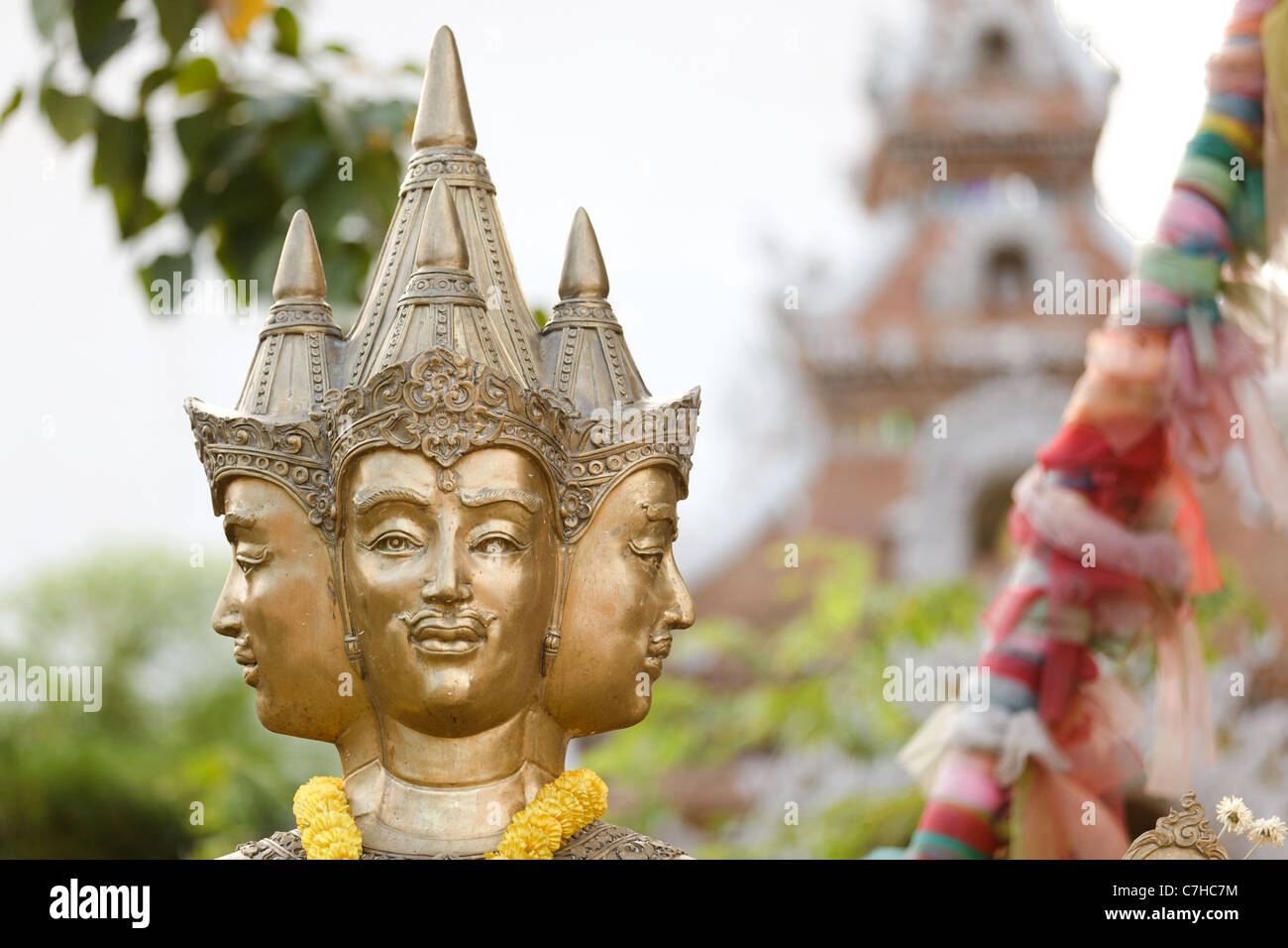 three headed buddha statue in temple courtyard , chiang mai, thailand ...