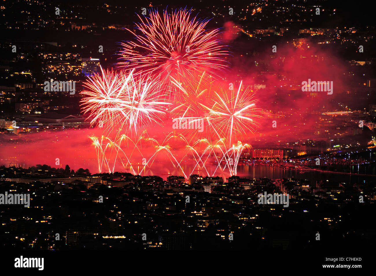 Firework burst in the night sky over Geneva. Taken from a high point ...