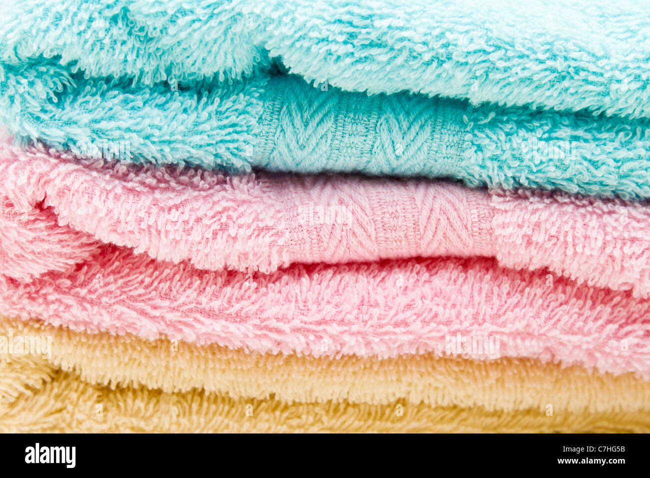 Different shades of towels stacked on each other Stock Photo - Alamy