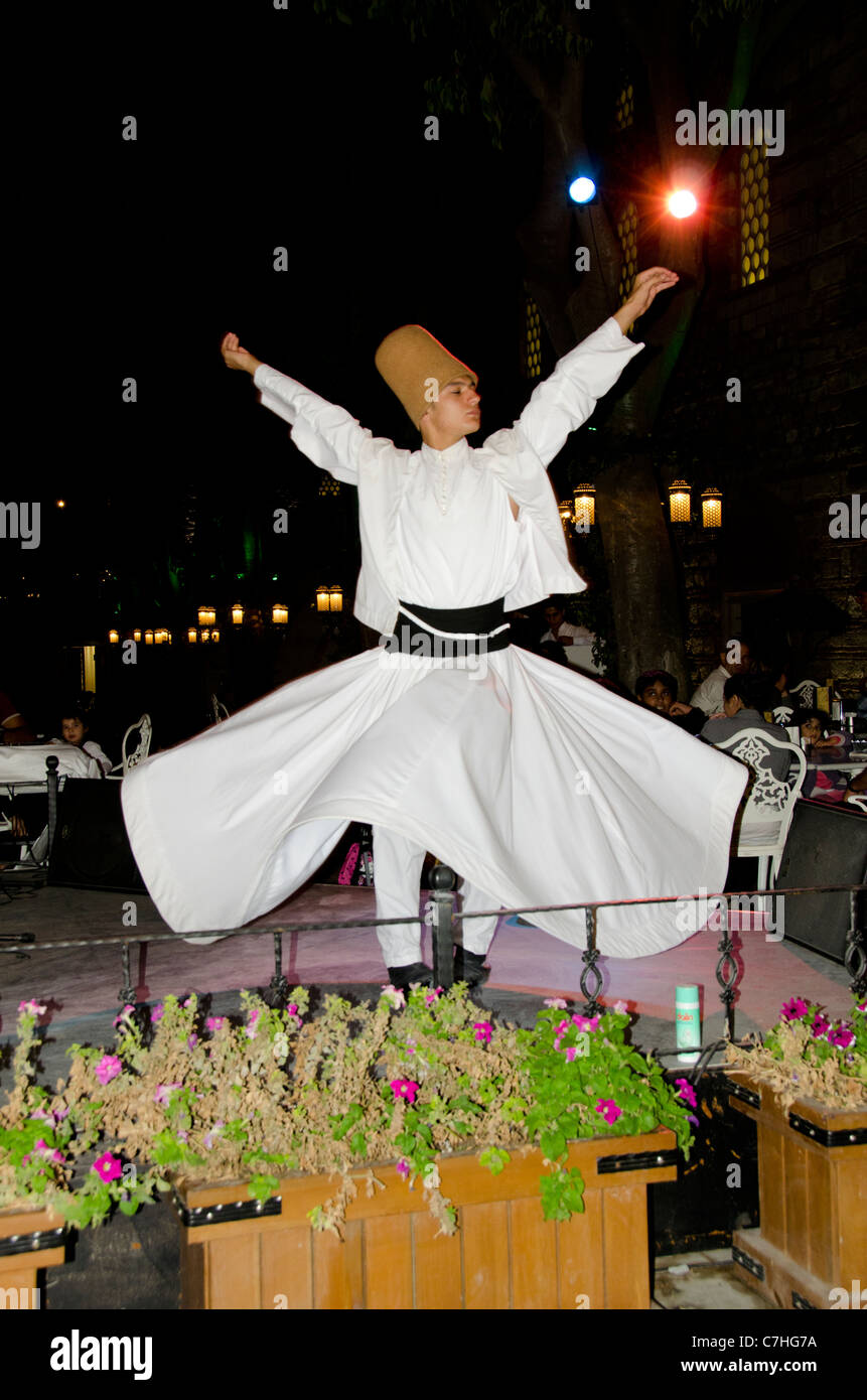 Turkey, Istanbul. Whirling dervish in traditional long robe and hat ...