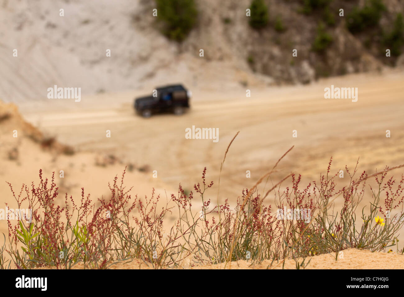 four wheel cars driving in a sand pit Stock Photo - Alamy