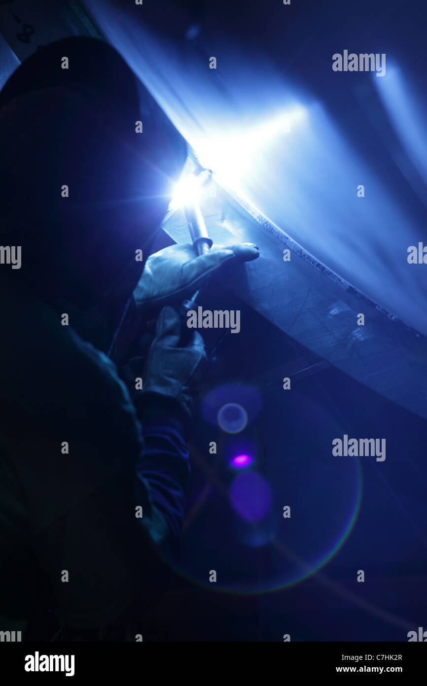 A welder welding the top on a pressure vessel Stock Photo - Alamy