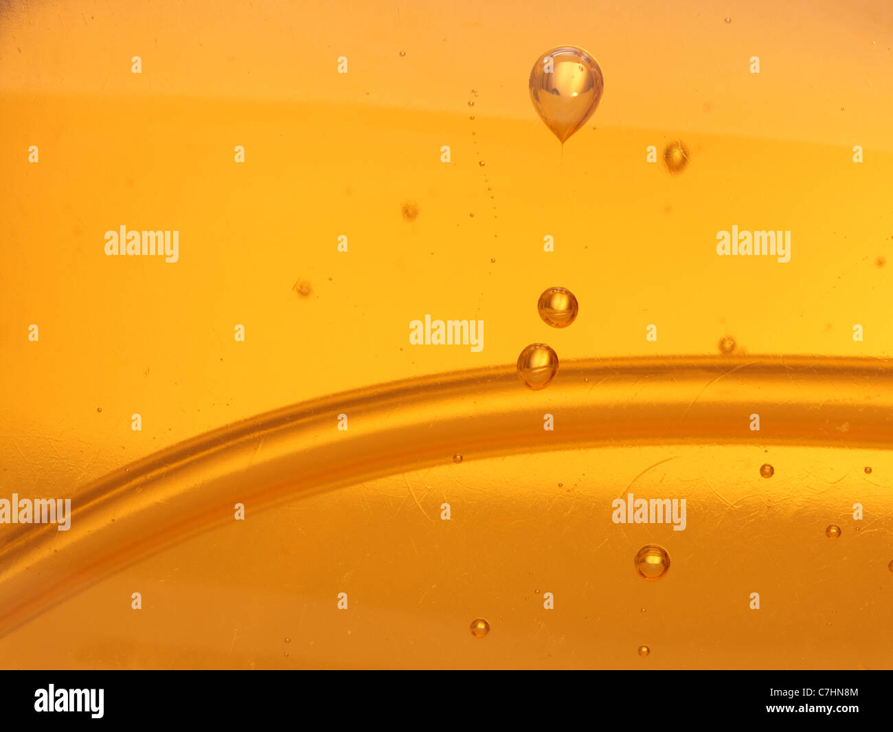 soap bubbles orange liquid background Stock Photo - Alamy