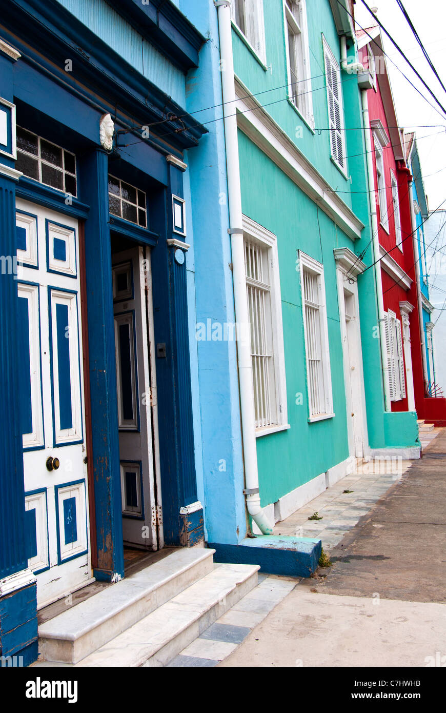 Row of colorful blue, turquoise, red and yellow buildings, metal ...