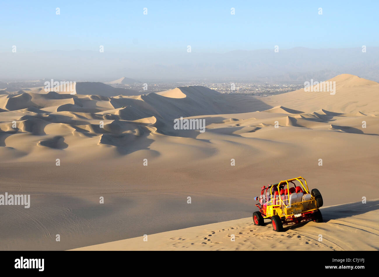 View of Sand Dessert with Dune Buggy in foreground Stock Photo - Alamy