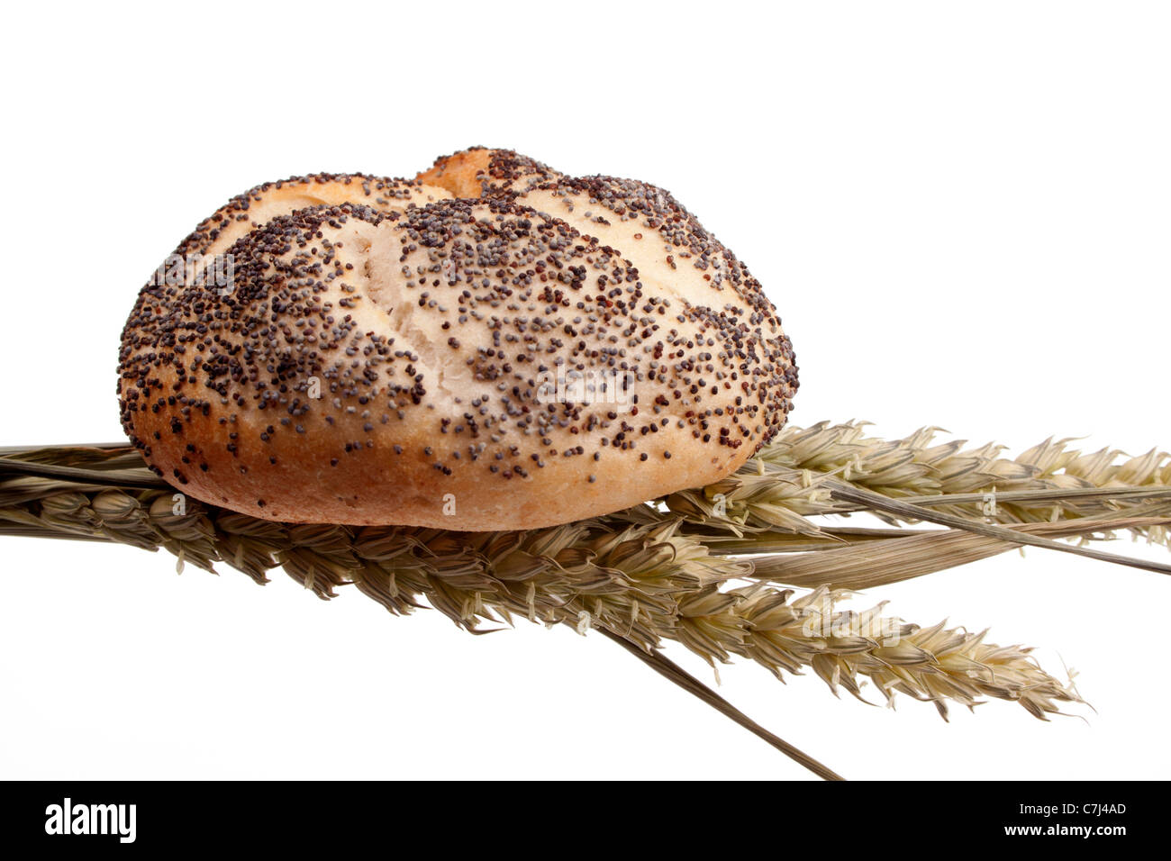 Bun and wheat on a white background Stock Photo - Alamy