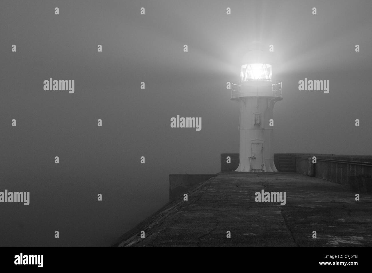 Lighthouse in the fog Black and White Stock Photos & Images - Alamy