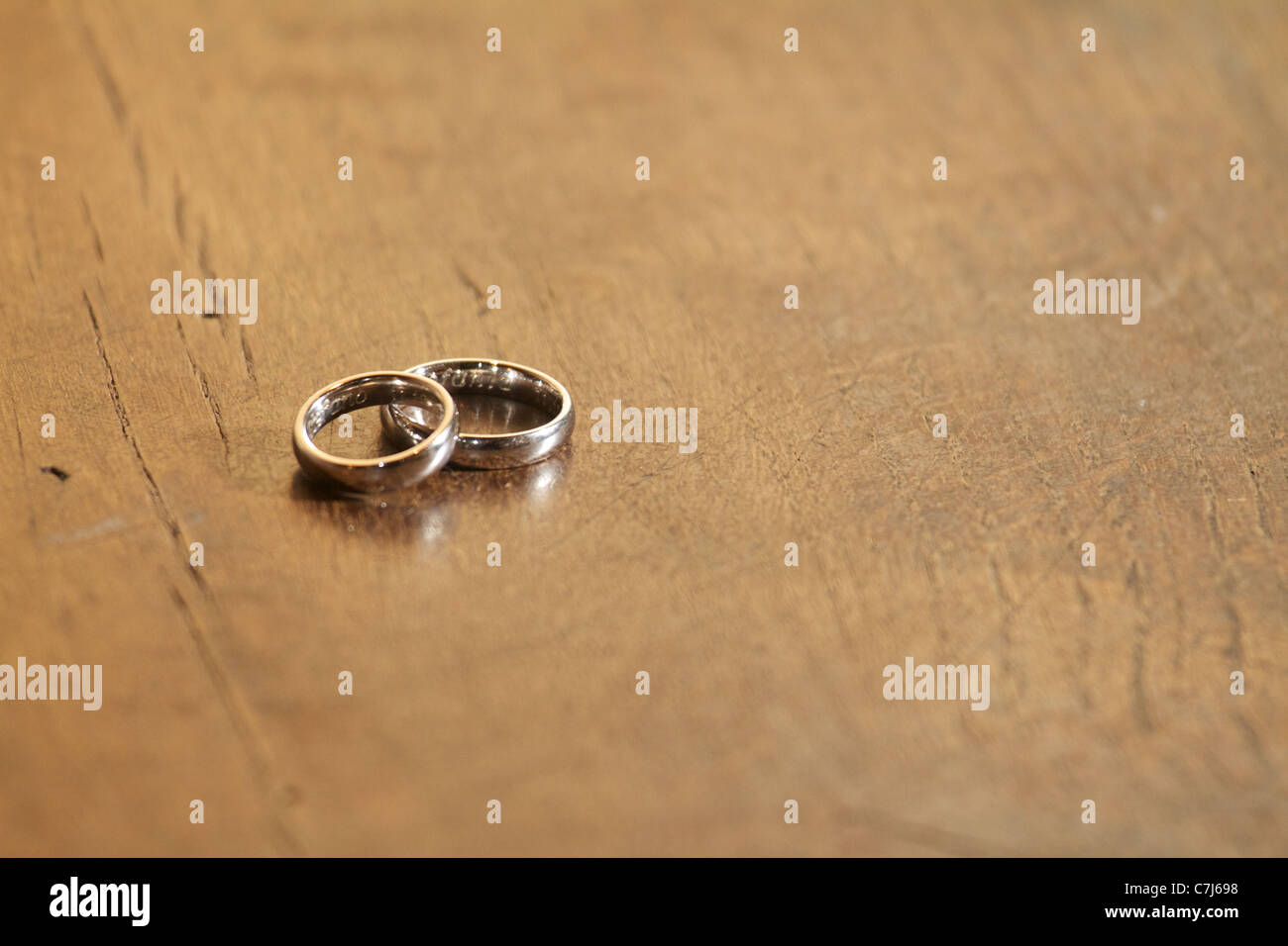 wedding rings on a table Stock Photo - Alamy