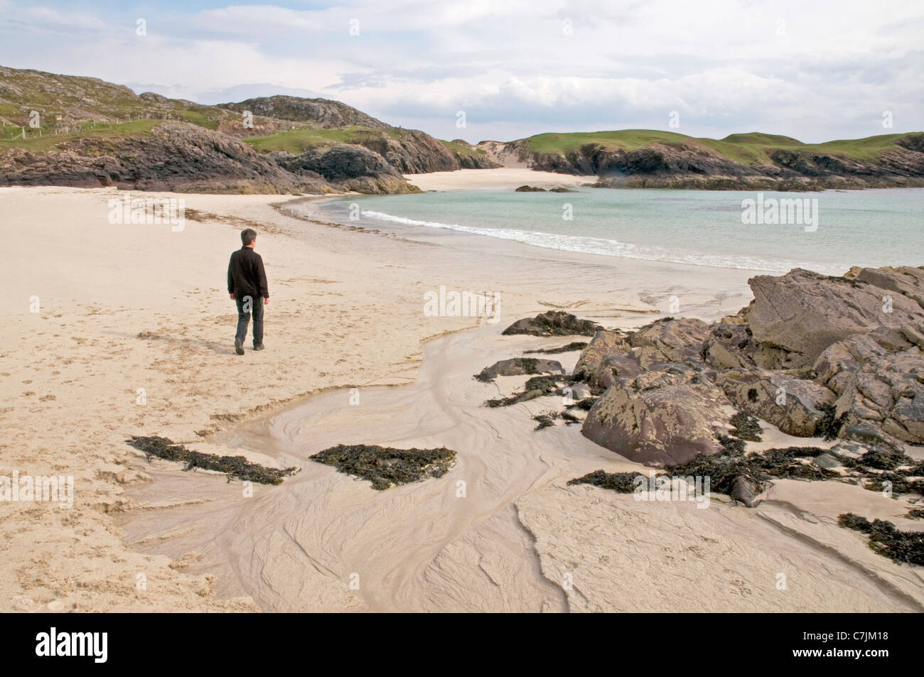 Attractive small sandy bay at Clachtoll on Scotland's northwestern ...