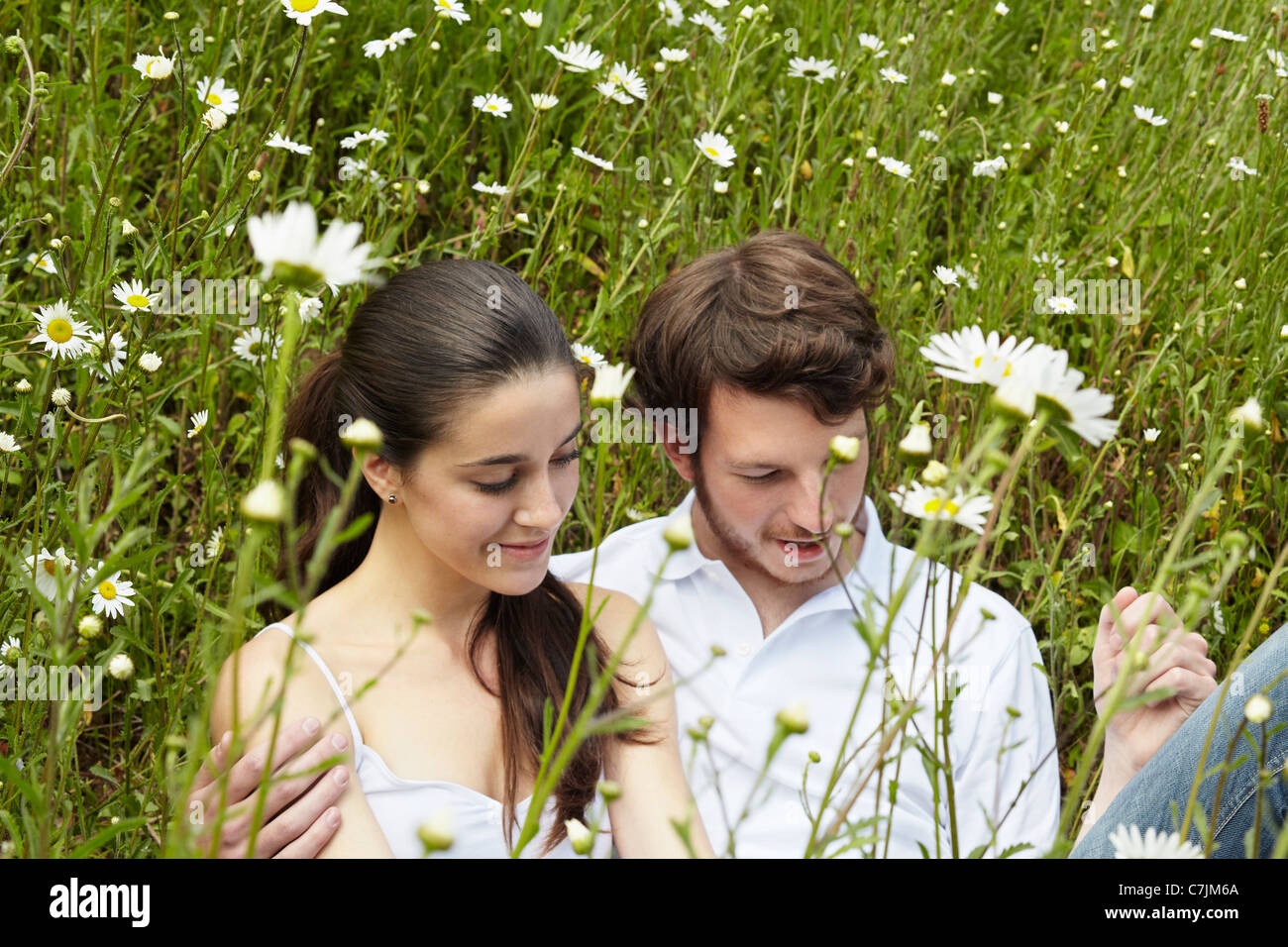 Woman laying in field flowers hi-res stock photography and images - Alamy