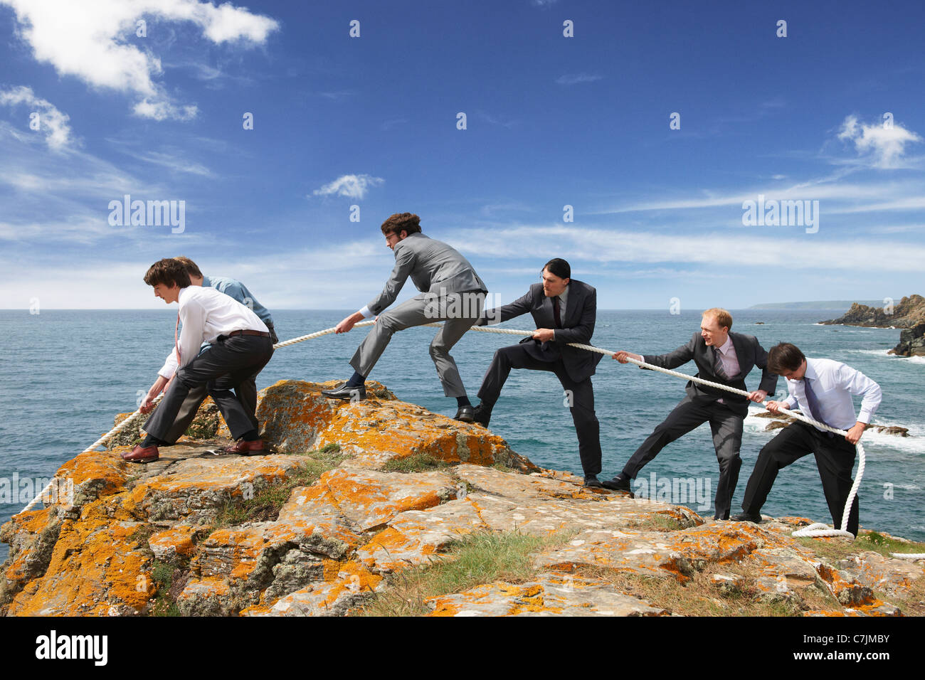Group business people pulling rope hi-res stock photography and images ...