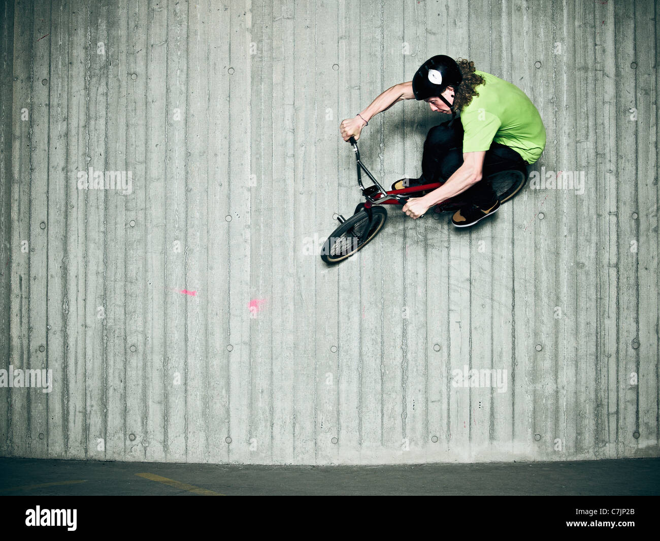 Man doing tricks on bmx bike indoors Stock Photo - Alamy