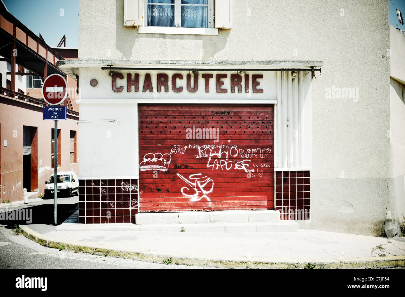 Closed butcher shop with graffiti on red metal door Stock Photo - Alamy