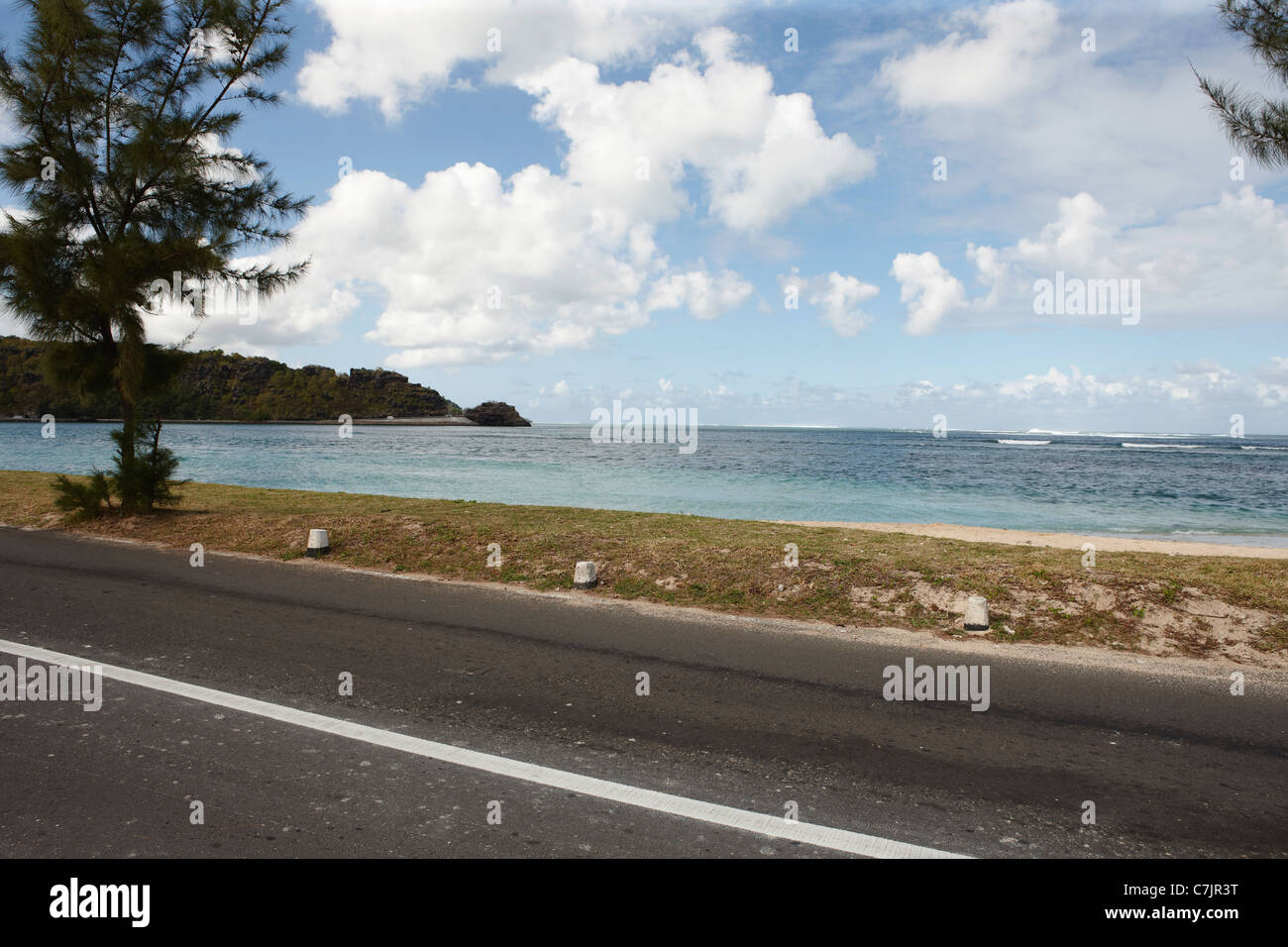 Paved road by beach Stock Photo - Alamy