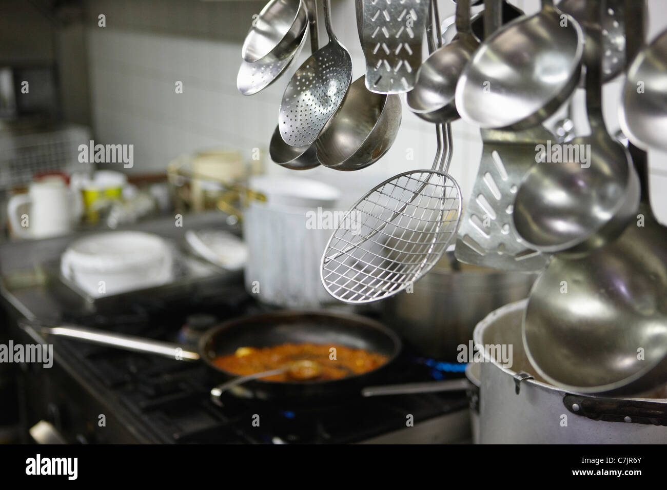Close up of spoons in restaurant kitchen Stock Photo - Alamy
