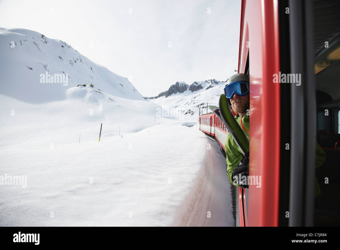 Train through snowy mountain hi-res stock photography and images - Alamy
