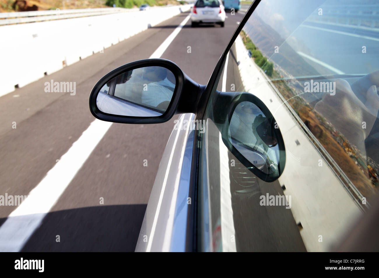 Car driving fast on the high road Stock Photo - Alamy