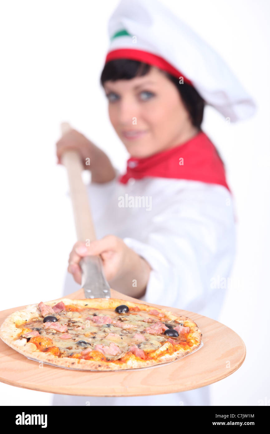 Pizza maker displaying her pizza Stock Photo - Alamy