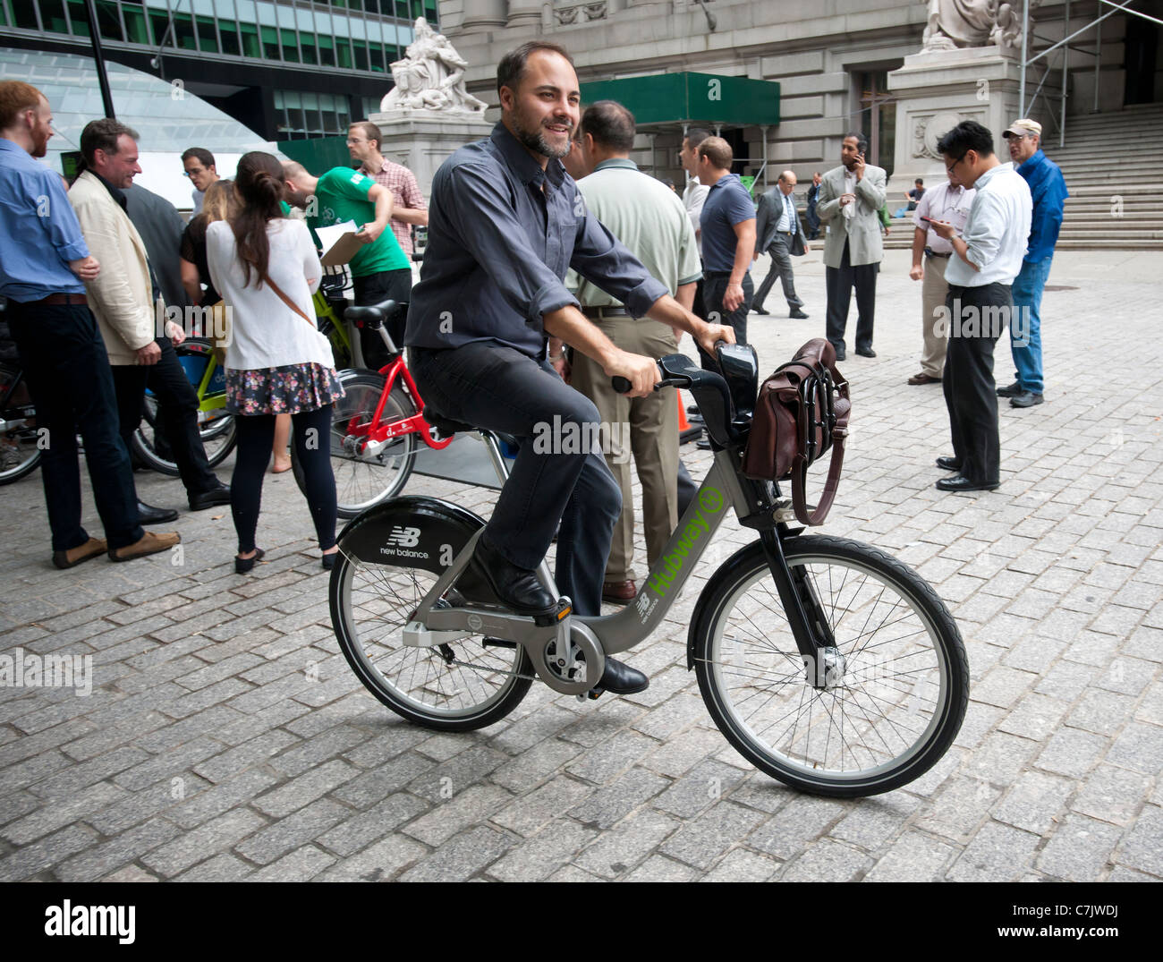 Passerby try out bicycles at an Alta Bicycle Share demonstration of ...