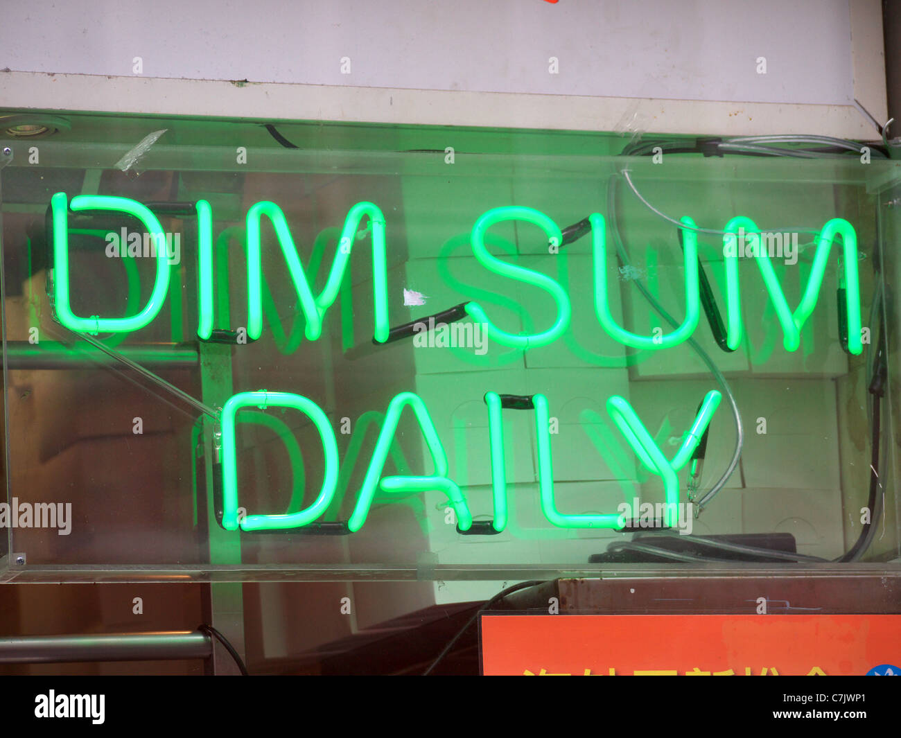 Neon sign advertising Dim Sum Daily in the window of a Chinese ...