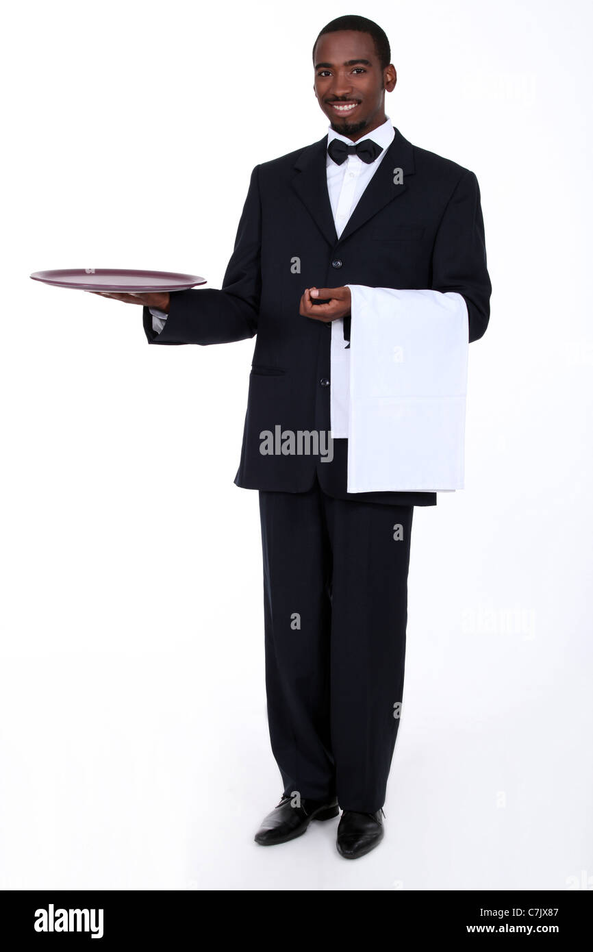 Butler with an empty tray Stock Photo - Alamy