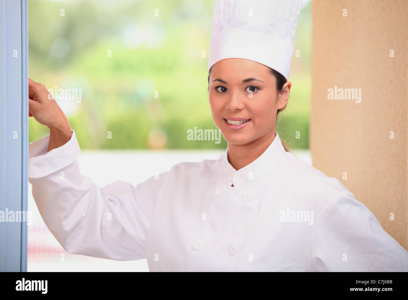 Chef standing in doorway Stock Photo - Alamy