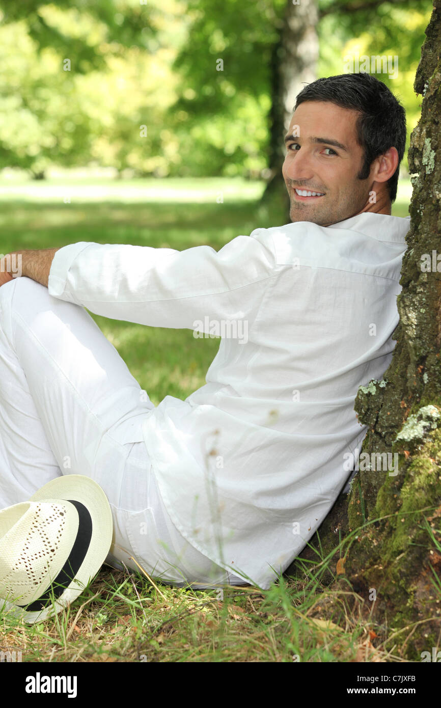 Man resting under tree hi-res stock photography and images - Alamy