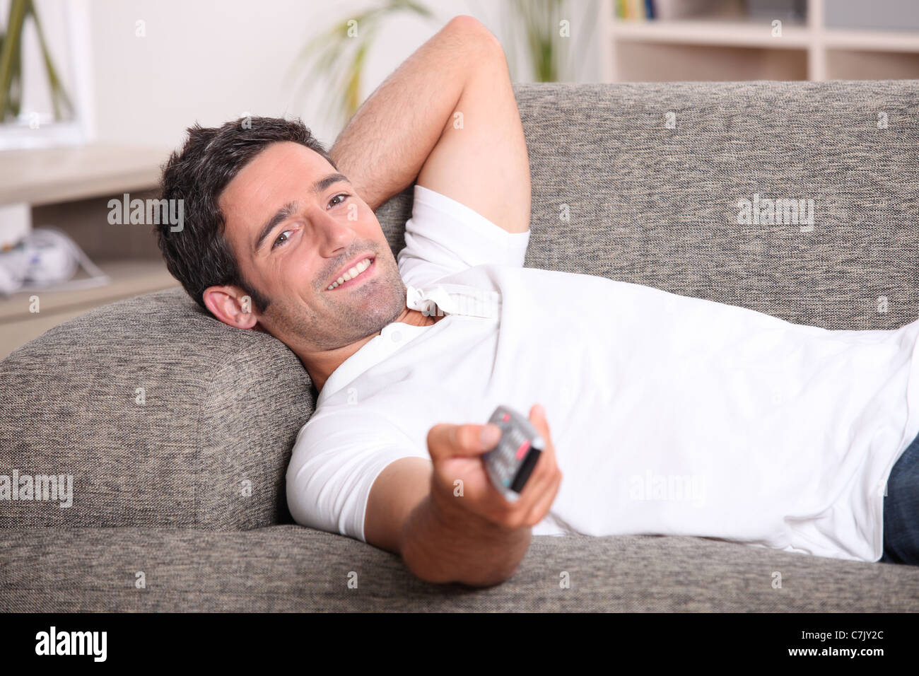 portrait of a man watching TV Stock Photo - Alamy