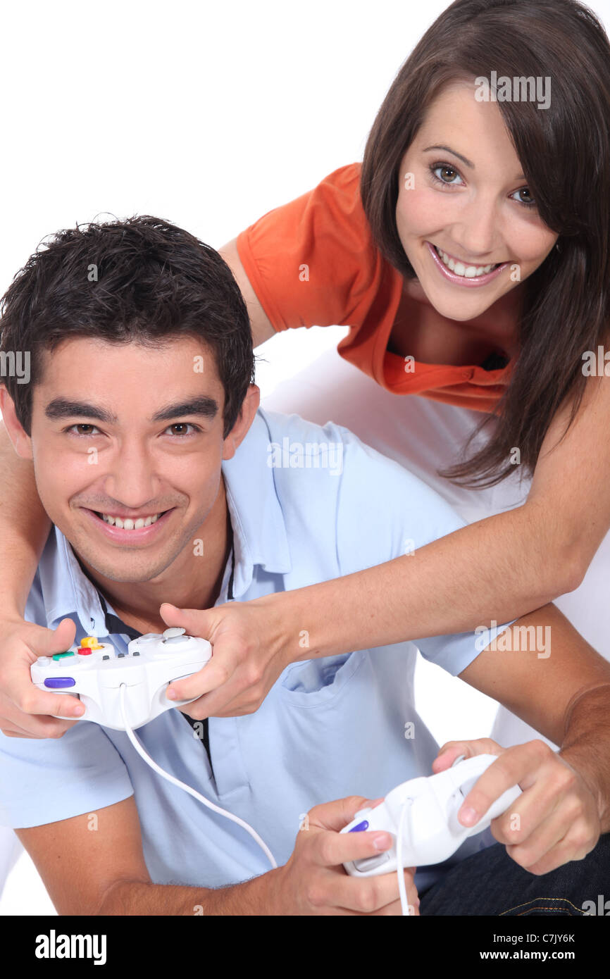 young people playing video game Stock Photo - Alamy