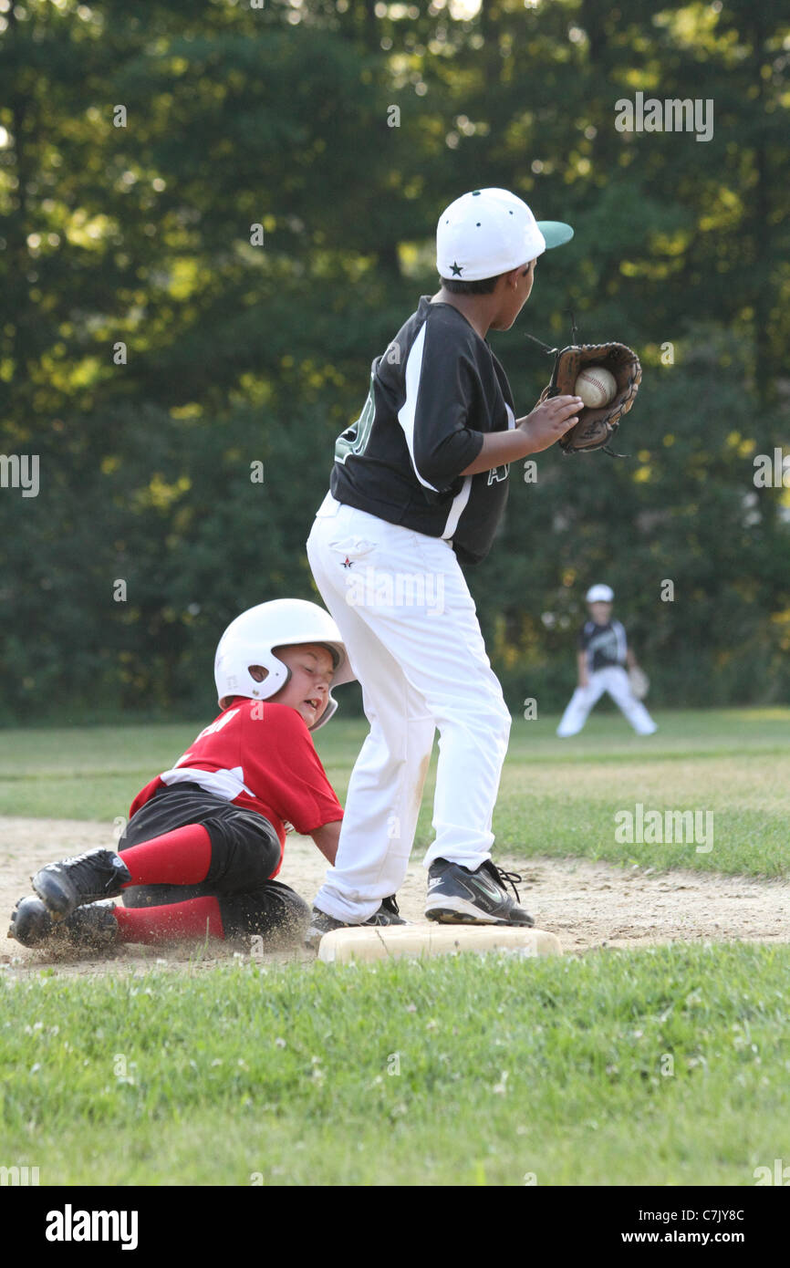 Slide into third and out Stock Photo - Alamy