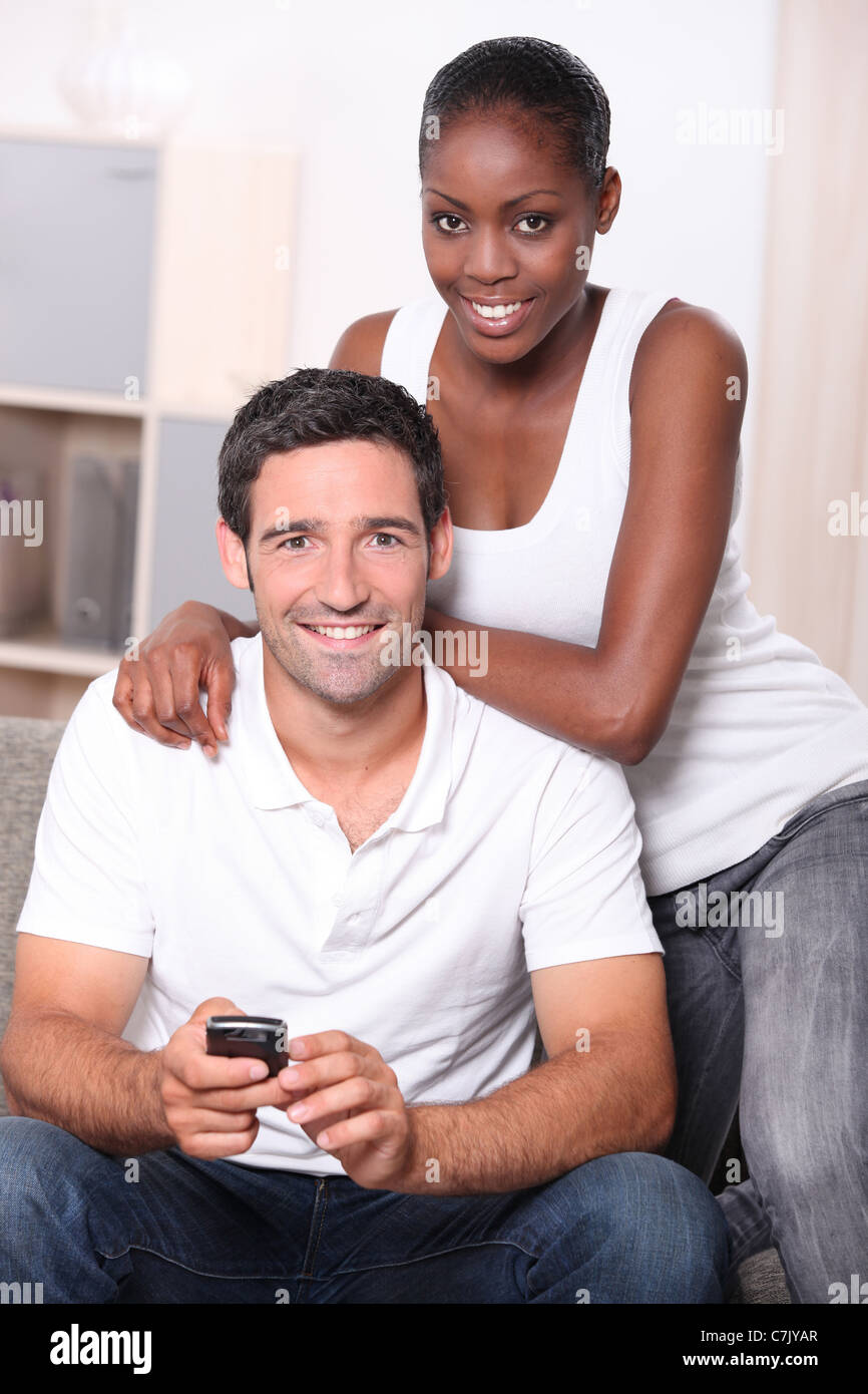 Man and woman watching television Stock Photo - Alamy