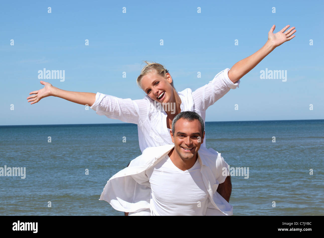 Couple by the sea Stock Photo - Alamy