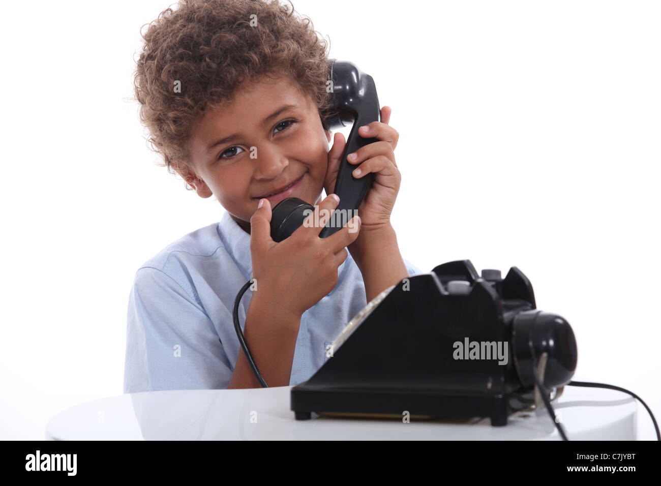 little boy calling with an old telephone Stock Photo - Alamy