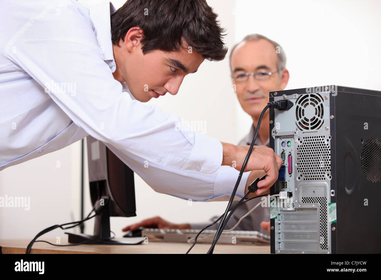 Man fixing a computer Stock Photo - Alamy