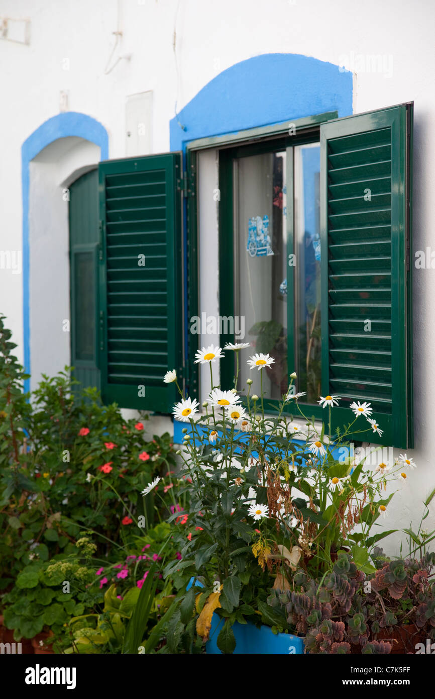 Portugal, Algarve, Ferragudo, Shuttered Windows & Flowers Stock Photo ...