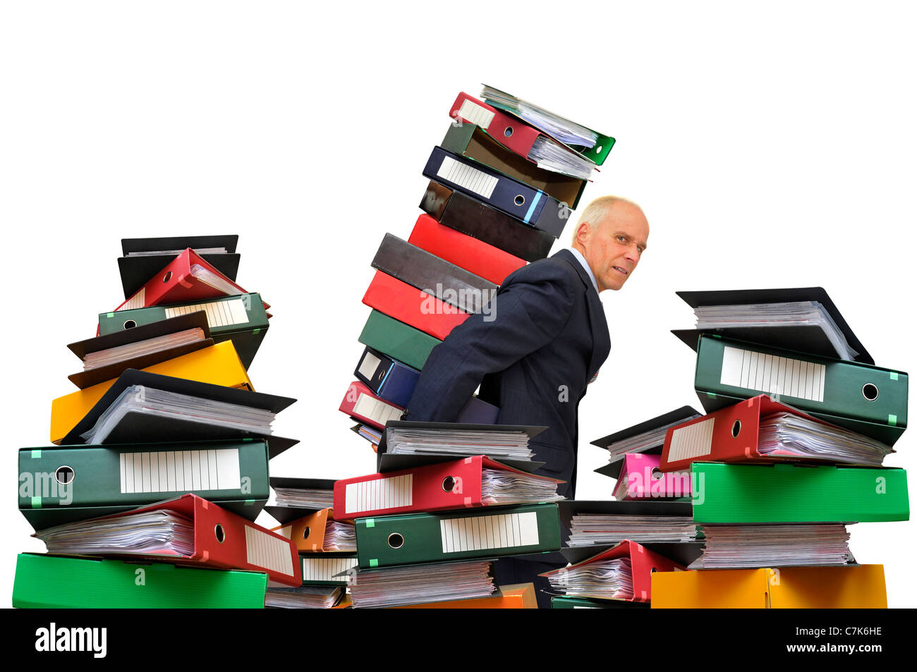 Worker with stack of files isolated in white Stock Photo - Alamy