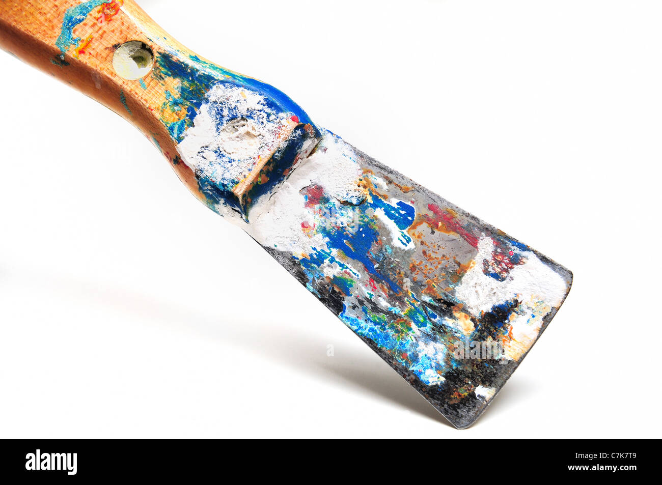 Used old scraper over white background Stock Photo - Alamy