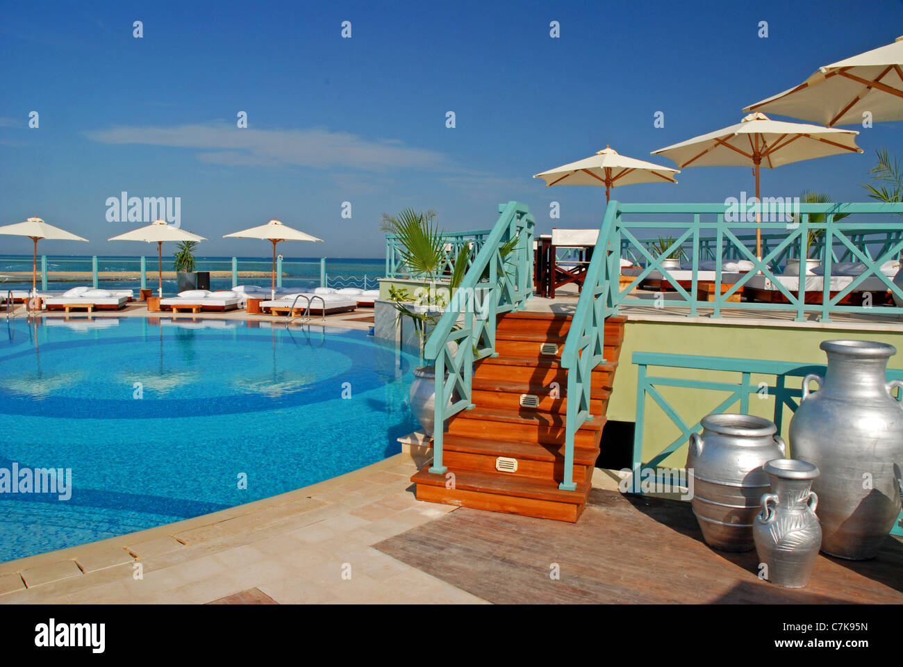 Luxury swimming pool in a tropical location Stock Photo - Alamy