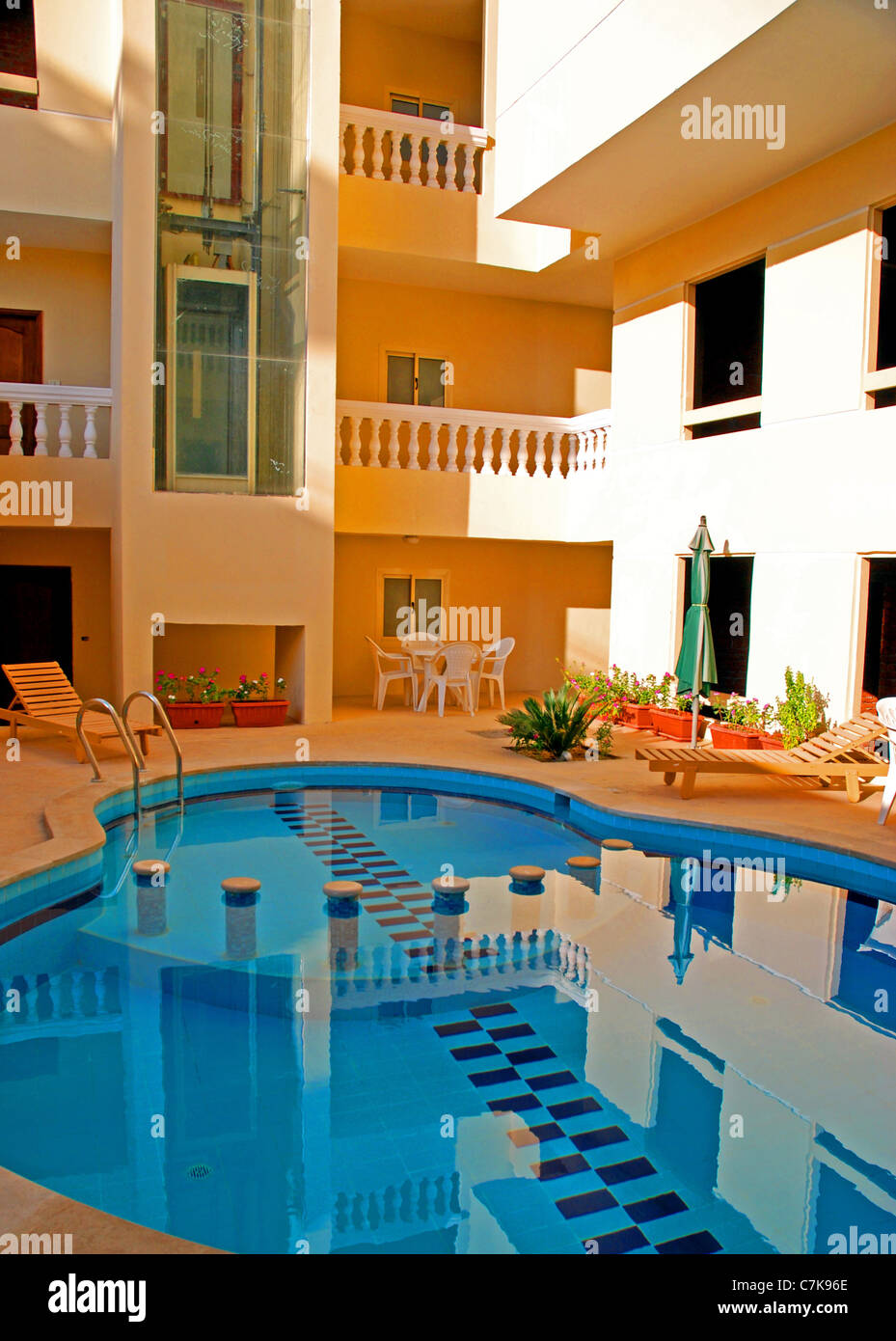 Apartment building swimming pool Stock Photo - Alamy