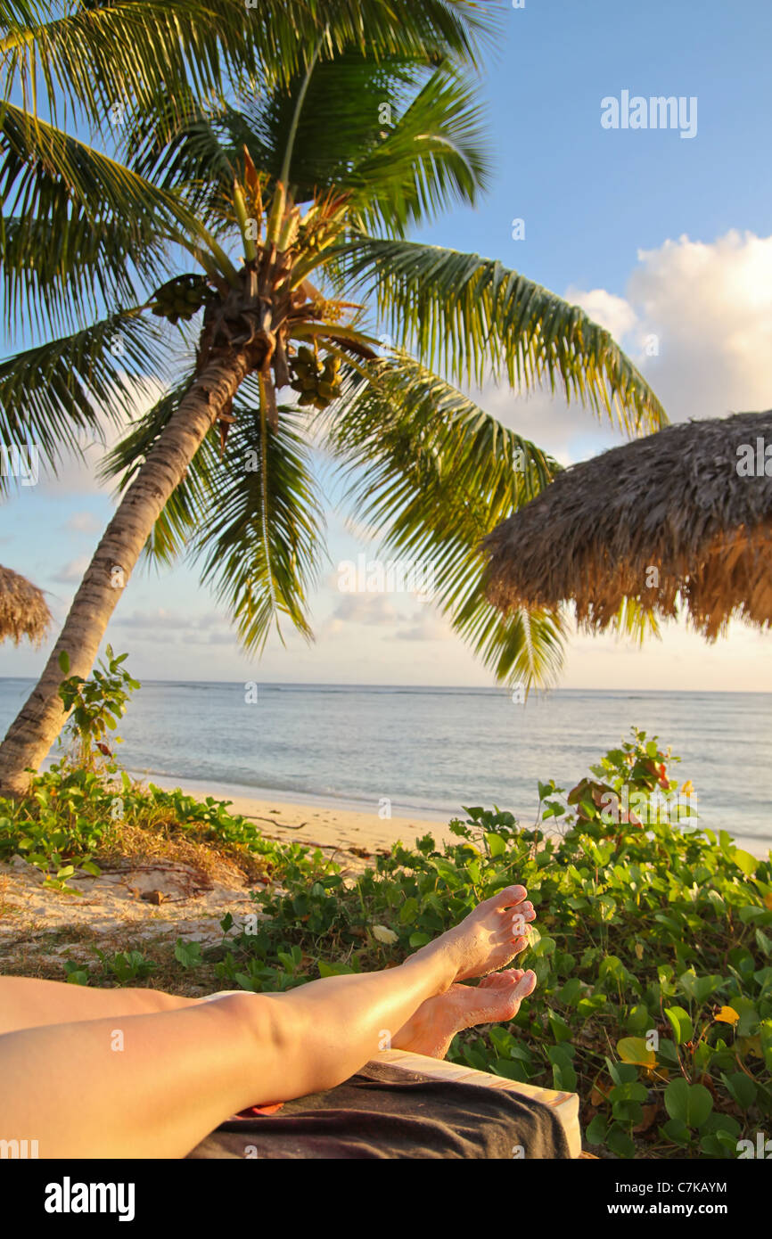 Young woman relaxing at the Anse La Reunion beach at La Digue Island ...