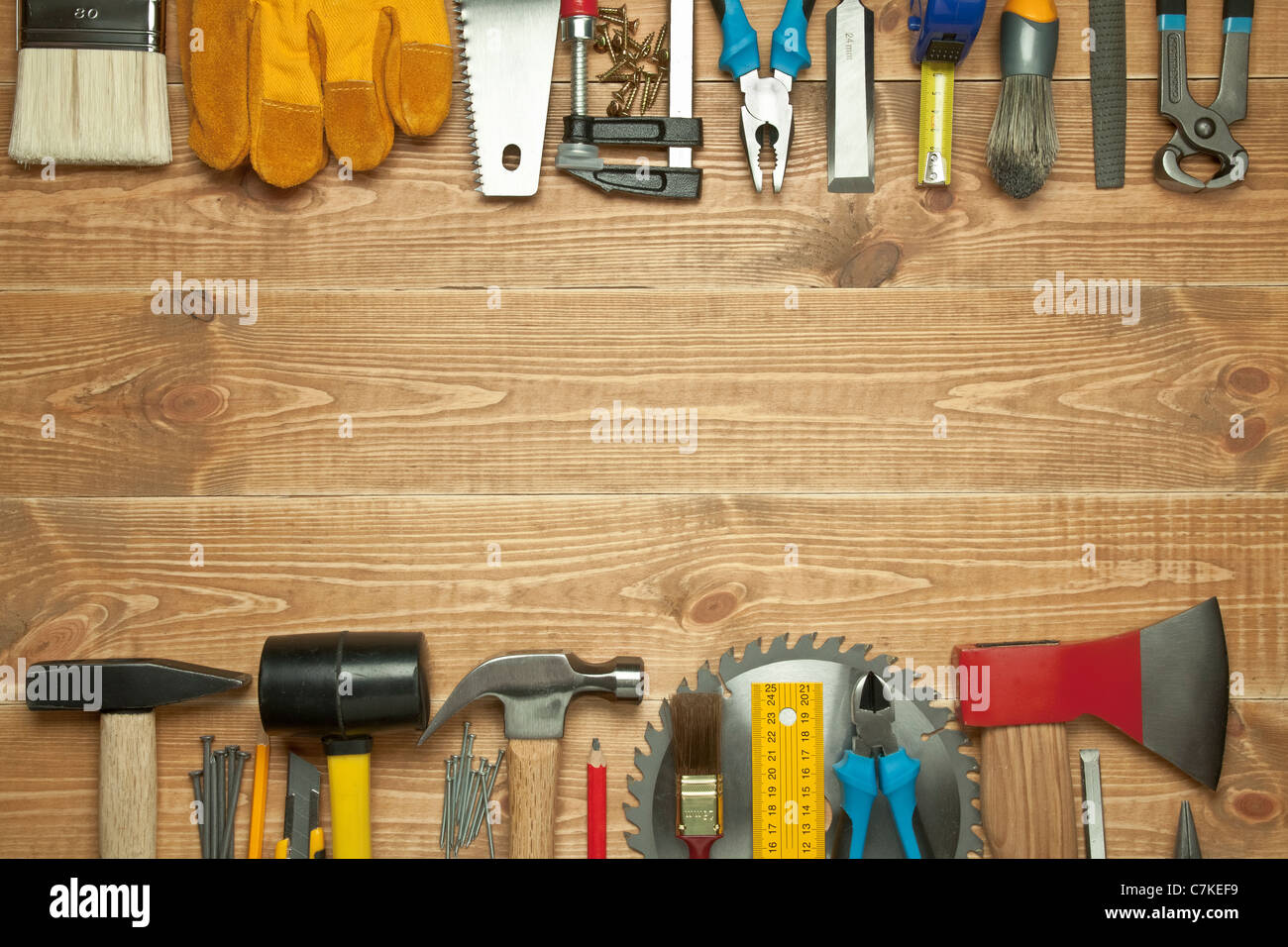 Different tools on a wooden background Stock Photo - Alamy