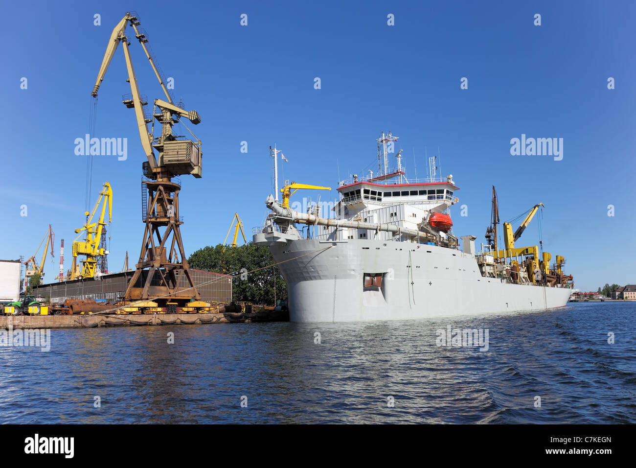 Dredging ship berthed at the wharf port in Gdansk, Poland Stock Photo ...