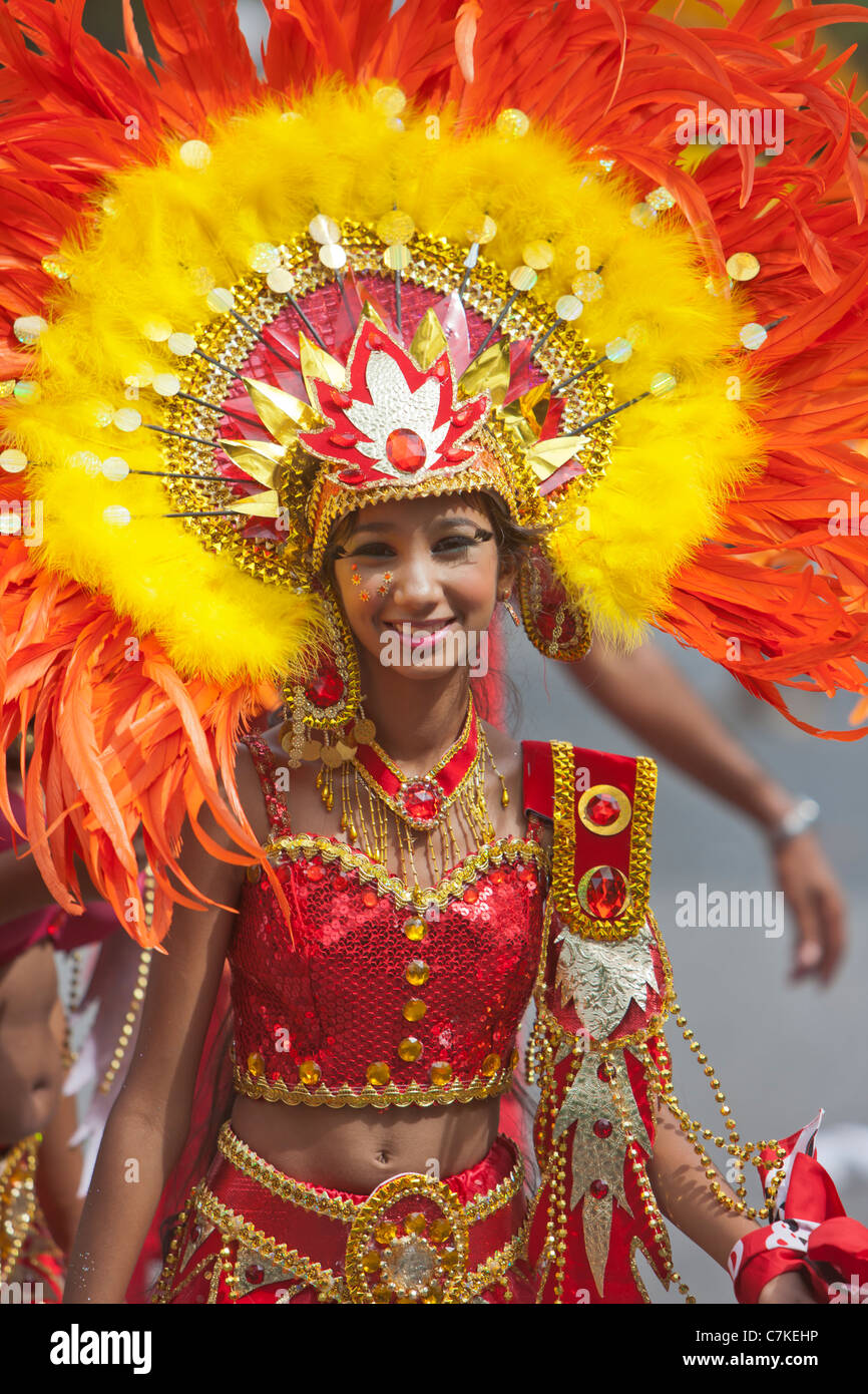 A parade participant in festive attire at the West Indian-American Day ...