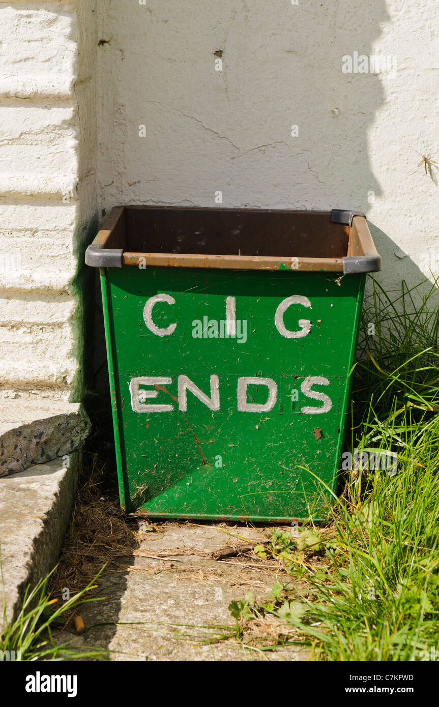 Metal bucket labelled "Cig Ends" for cigarette butts Stock Photo - Alamy
