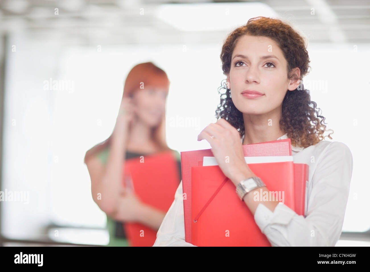 Businesswoman folders on head hi-res stock photography and images - Alamy