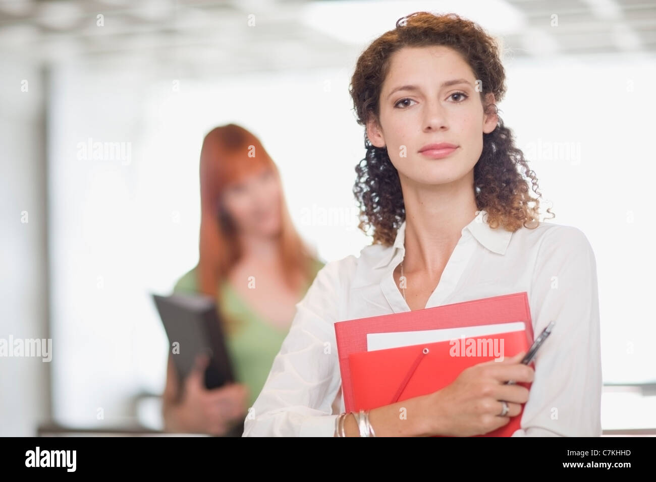 Businesswoman holding folders Stock Photo - Alamy Businesswoman holding folders Stock Photo - Alamy