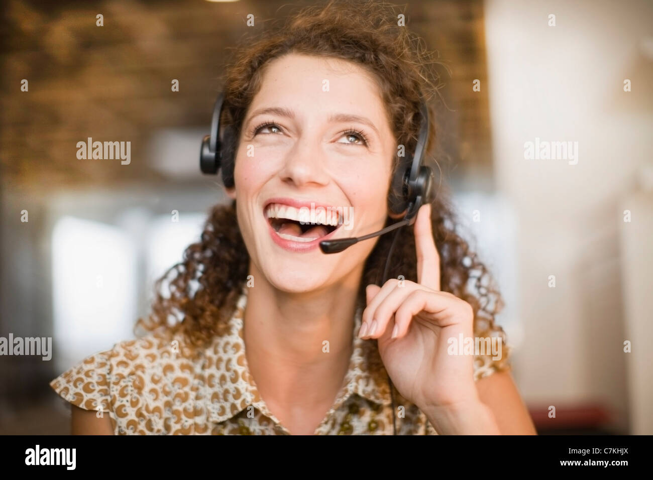 Smiling woman wearing headset Stock Photo - Alamy