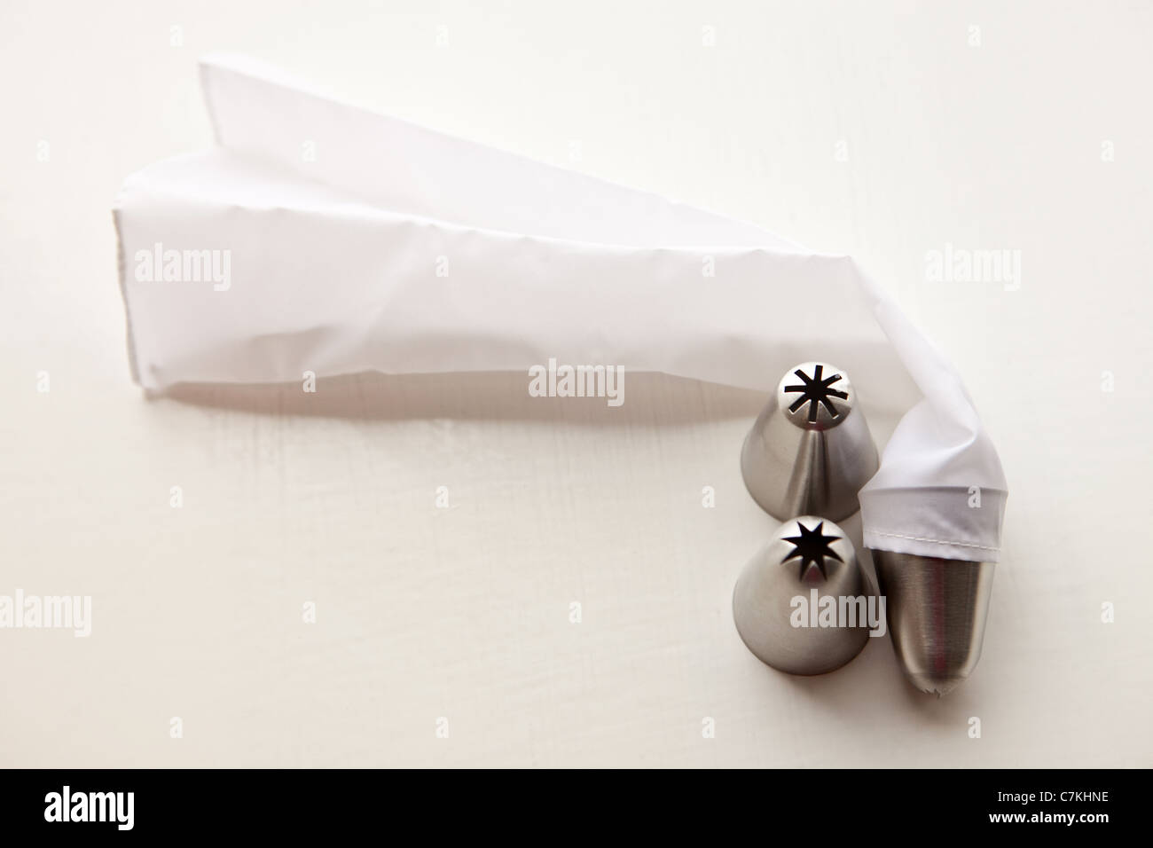 Three piece set of shaped piping for decorating home baking Stock Photo ...