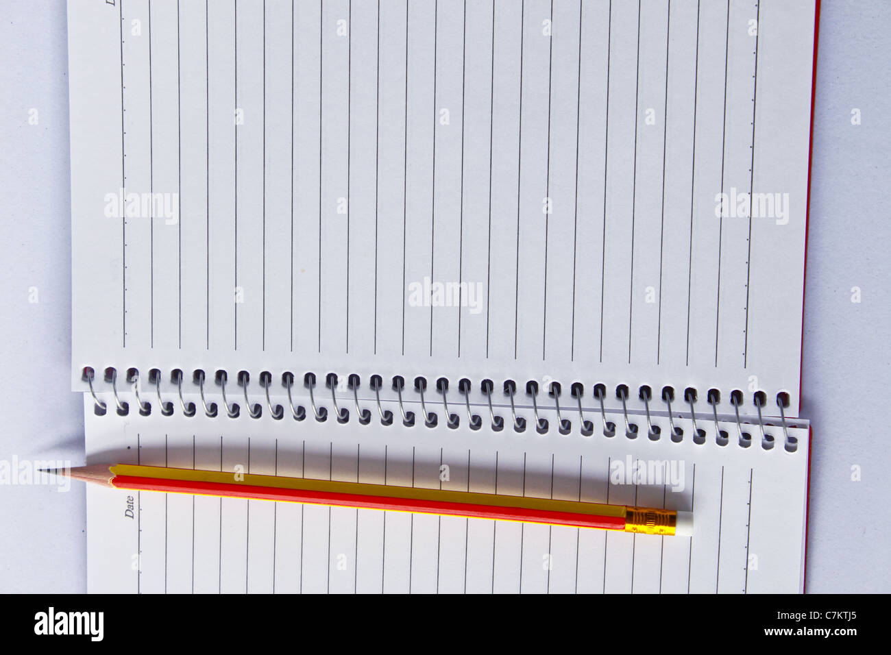 red pencil and open note book on white background Stock Photo - Alamy