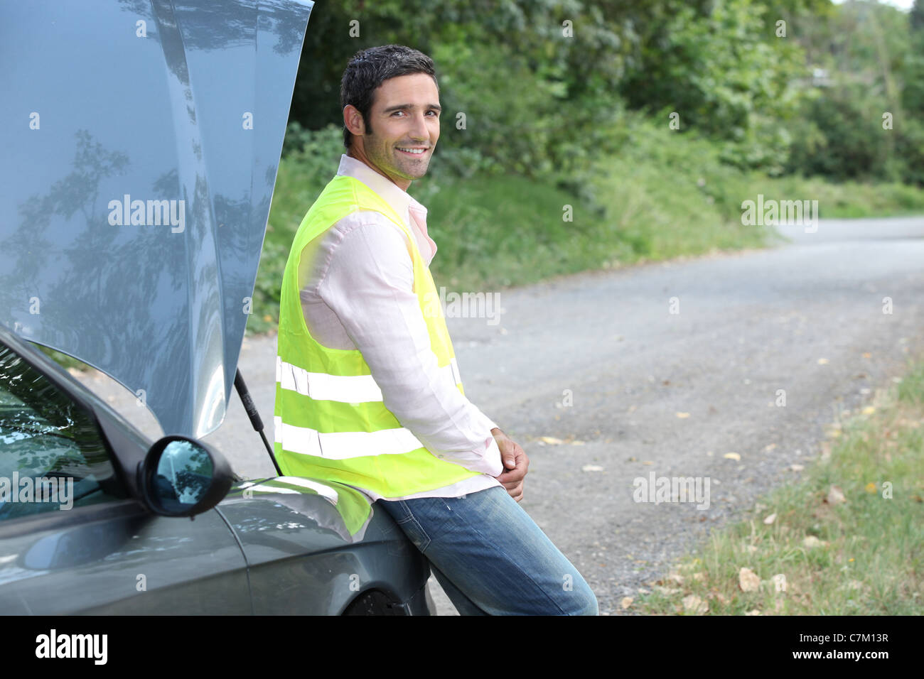 Man awaiting roadside assistance Stock Photo - Alamy